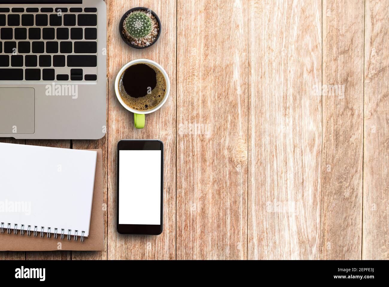 Modern wood office desk table with laptop, smartphone, cup of coffee ...