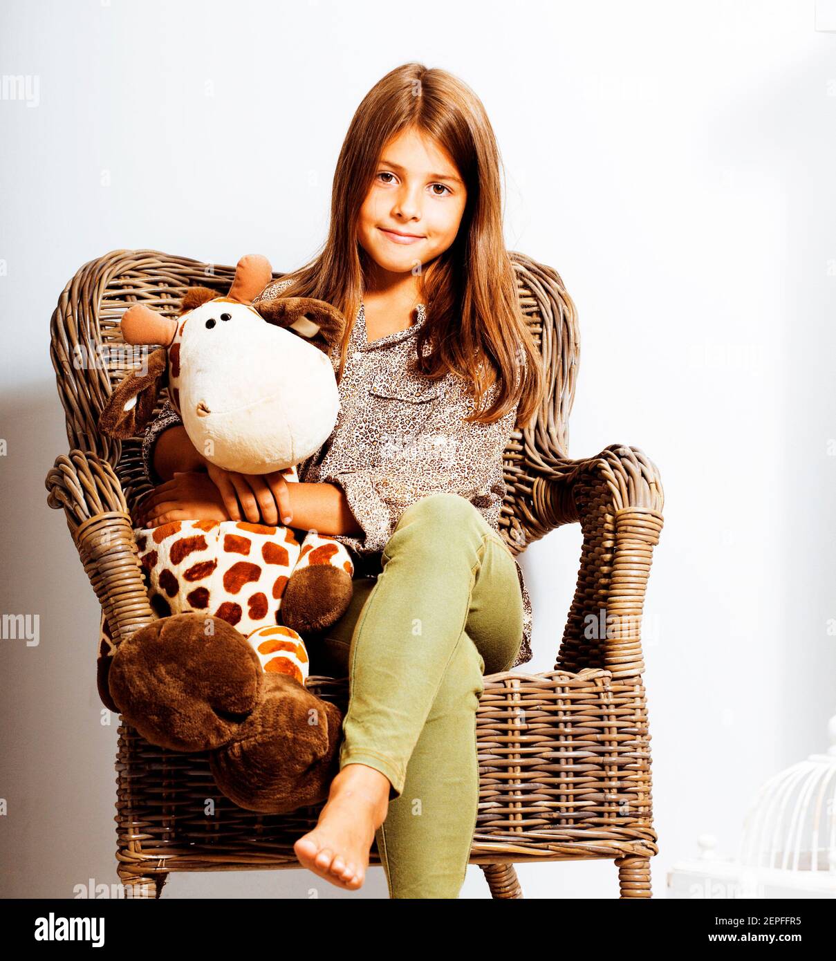 little cute brunette girl at home interior happy smiling close up ...
