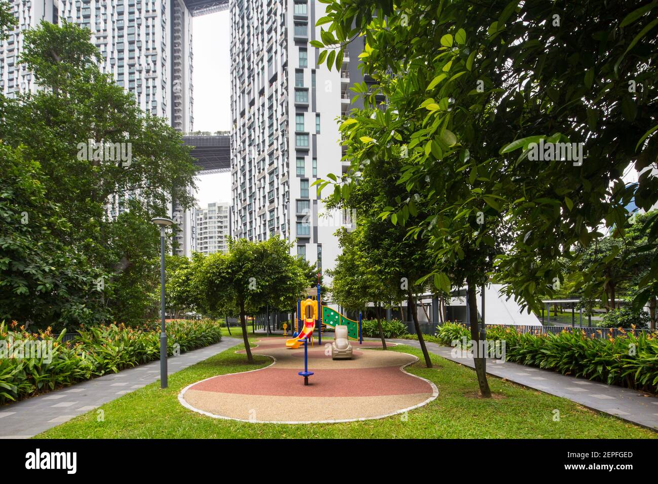 A playground in residential greenery area Stock Photo - Alamy