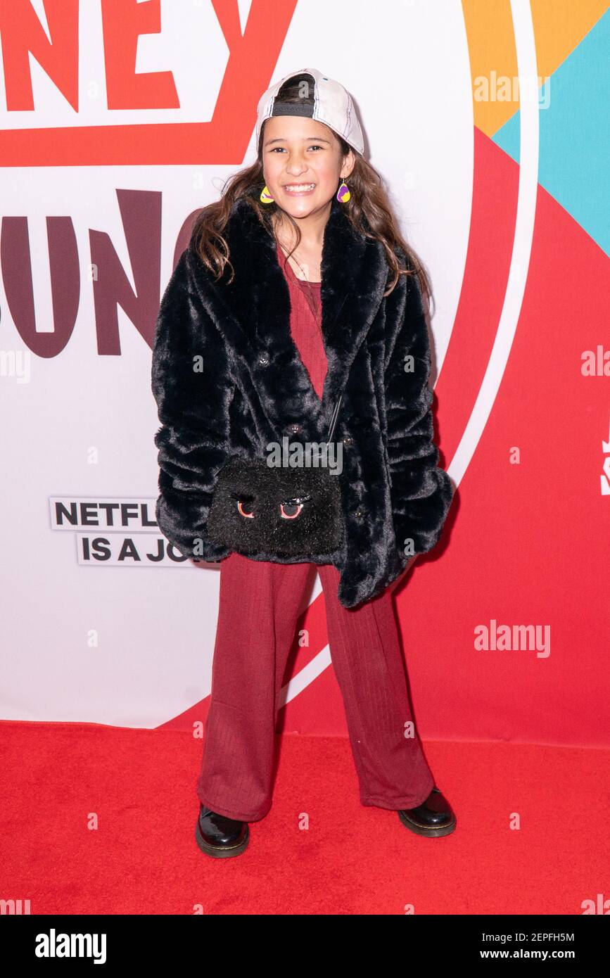 Linder Sutton attends the red carpet at the Netflix premiere of John ...