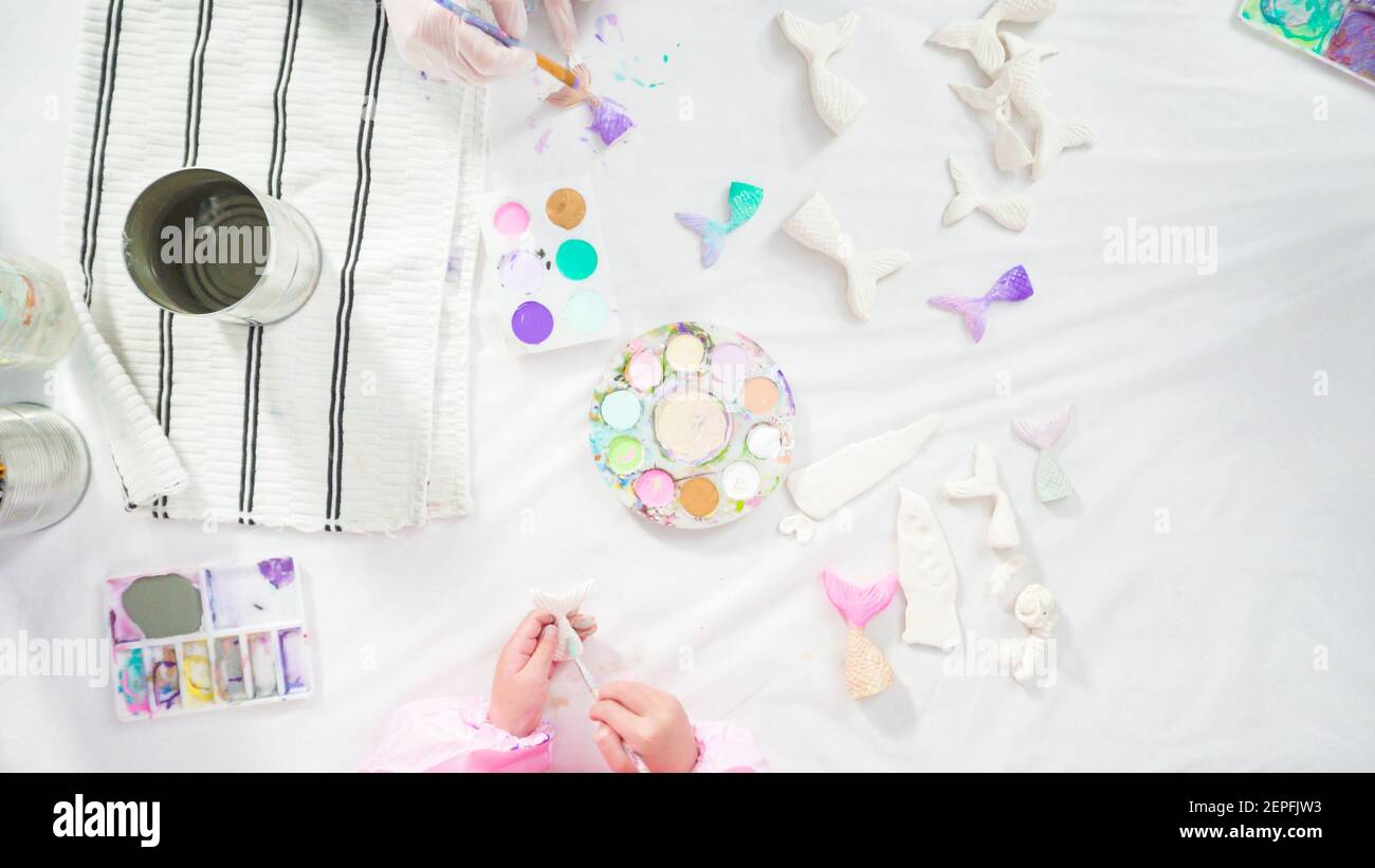 Flat lay. Step by step. Painting mermaid tails and seashells with ...