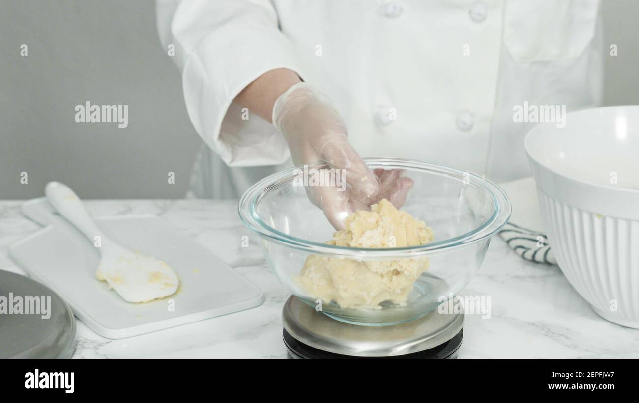 Step by step. Measuring cookie dought with a digital kitchen scale to ...