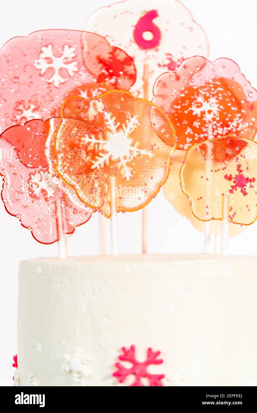 Tall round cake with Italian buttercream frosting decorated with ...