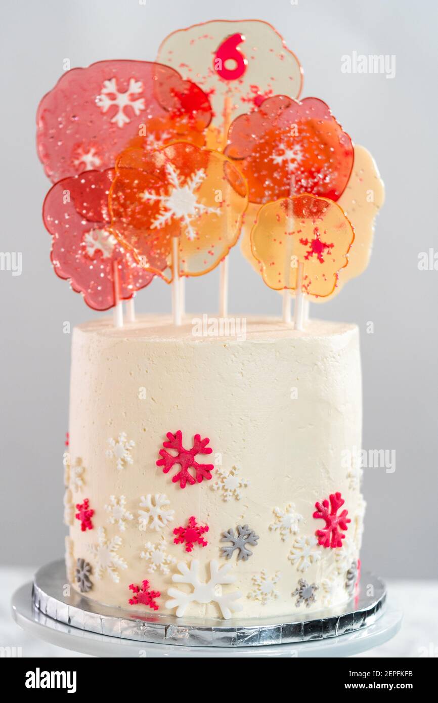 Tall round cake with Italian buttercream frosting decorated with ...