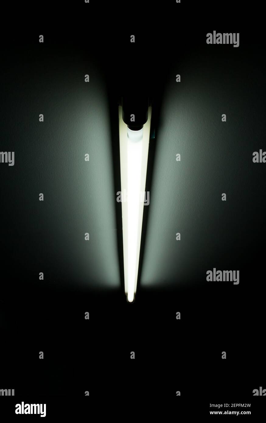 Detail of a fluorescent light tube on a wall. fluorescent light tube ...