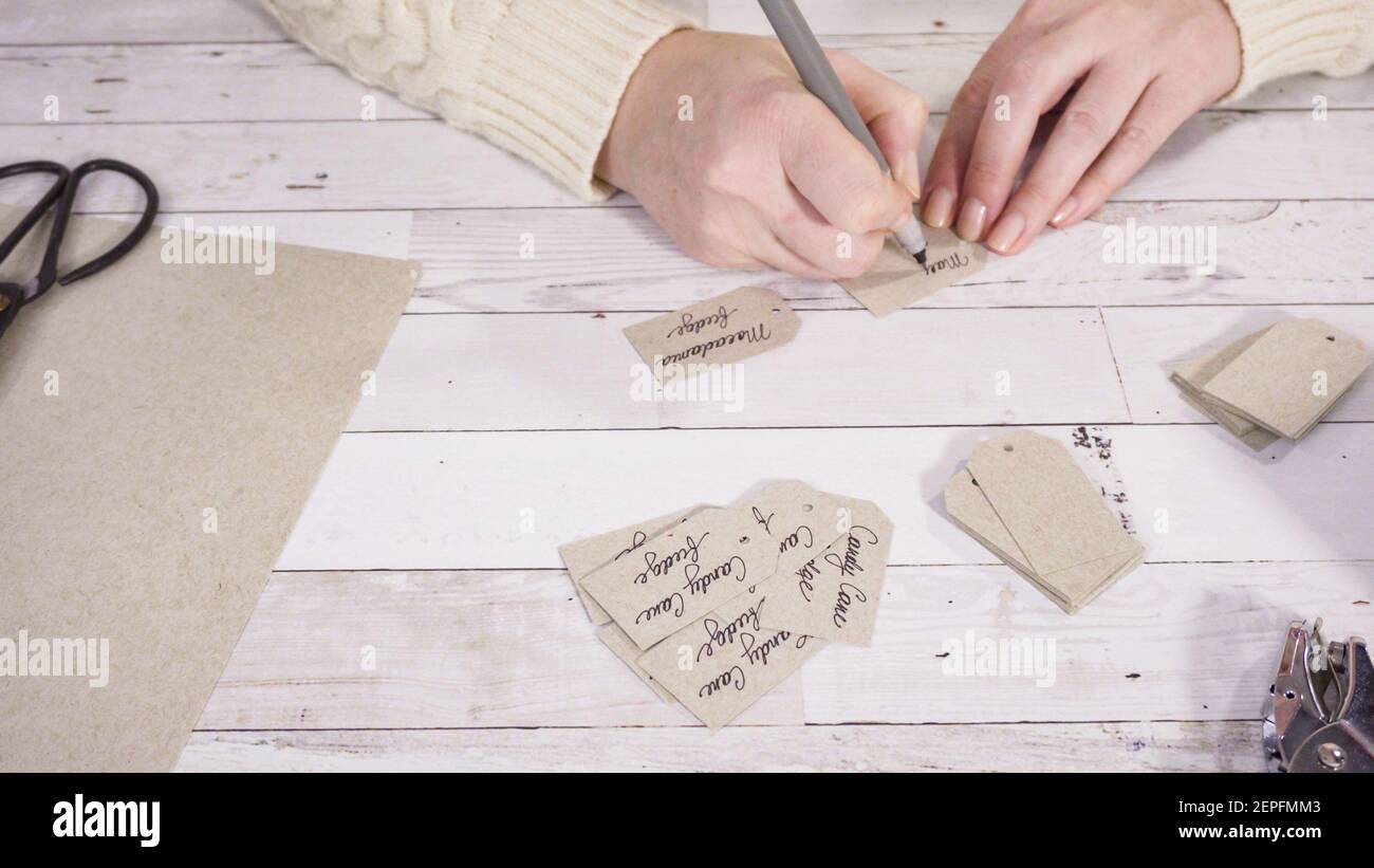 Cutting homemade gift tags hi-res stock photography and images - Alamy