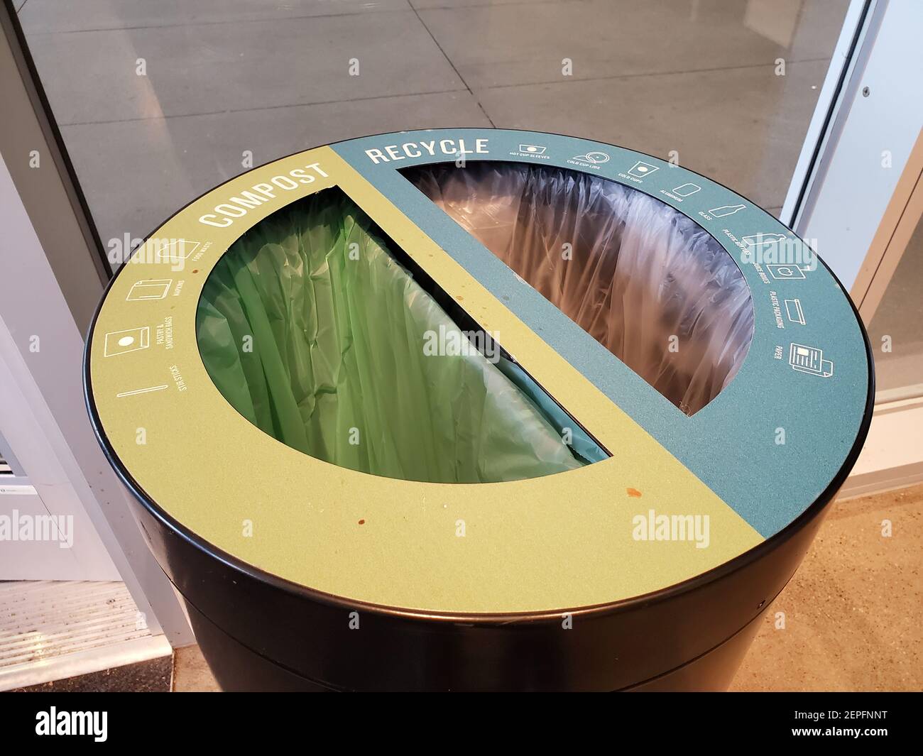 Close-up of refuse bin in a retail store, with separate compartments ...