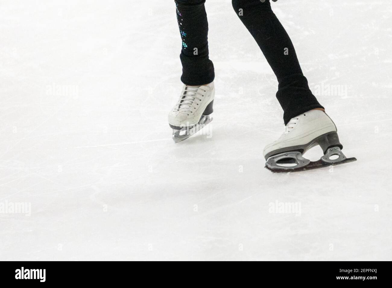 View of figure skater feet at the figure skating practice Stock Photo ...