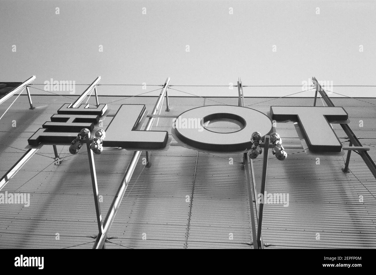 Black and white photo on true analog film of sign for The Lot upscale ...