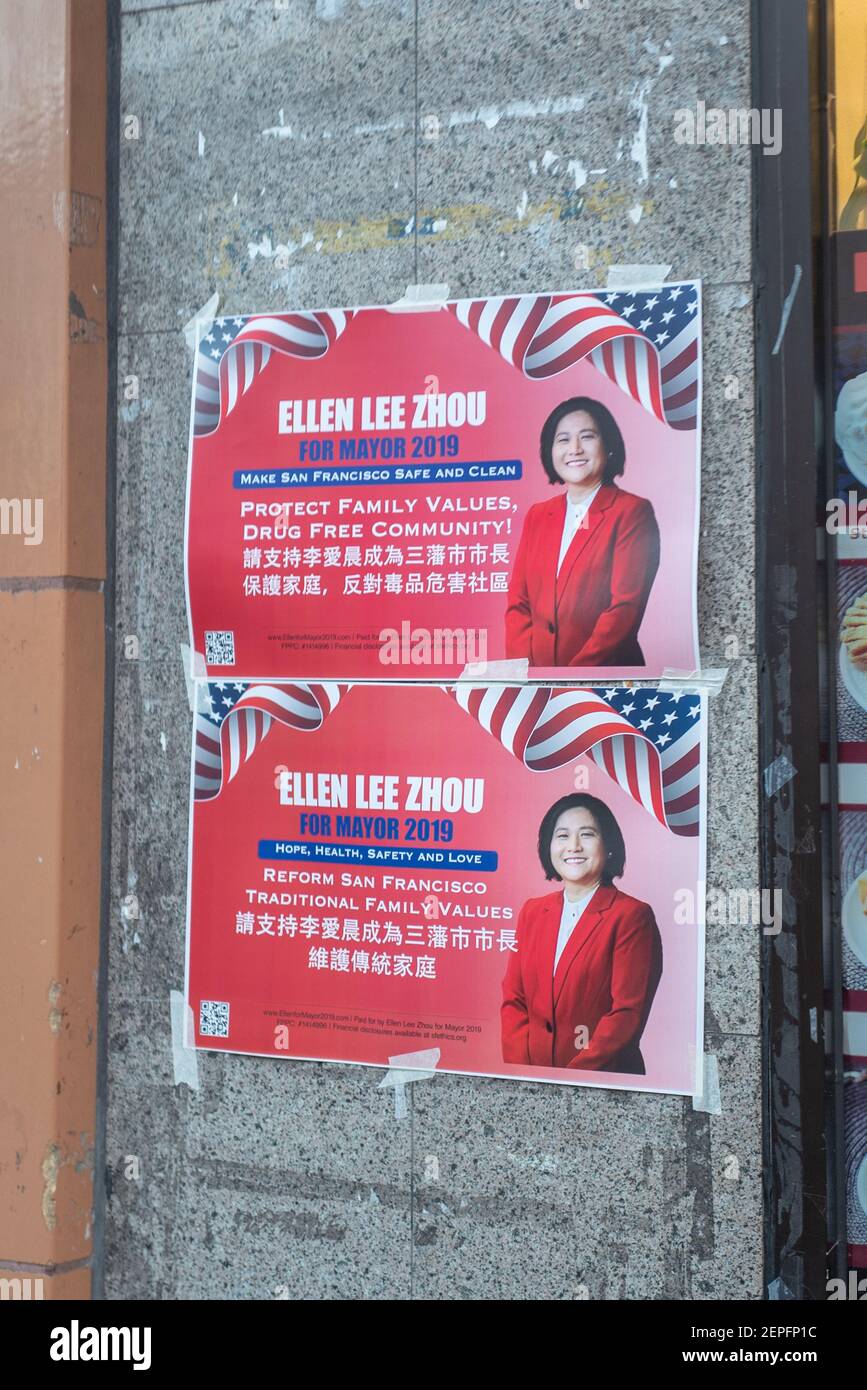 Paper signs on a wall for mayoral candidate Ellen Lee Zhou, with text ...