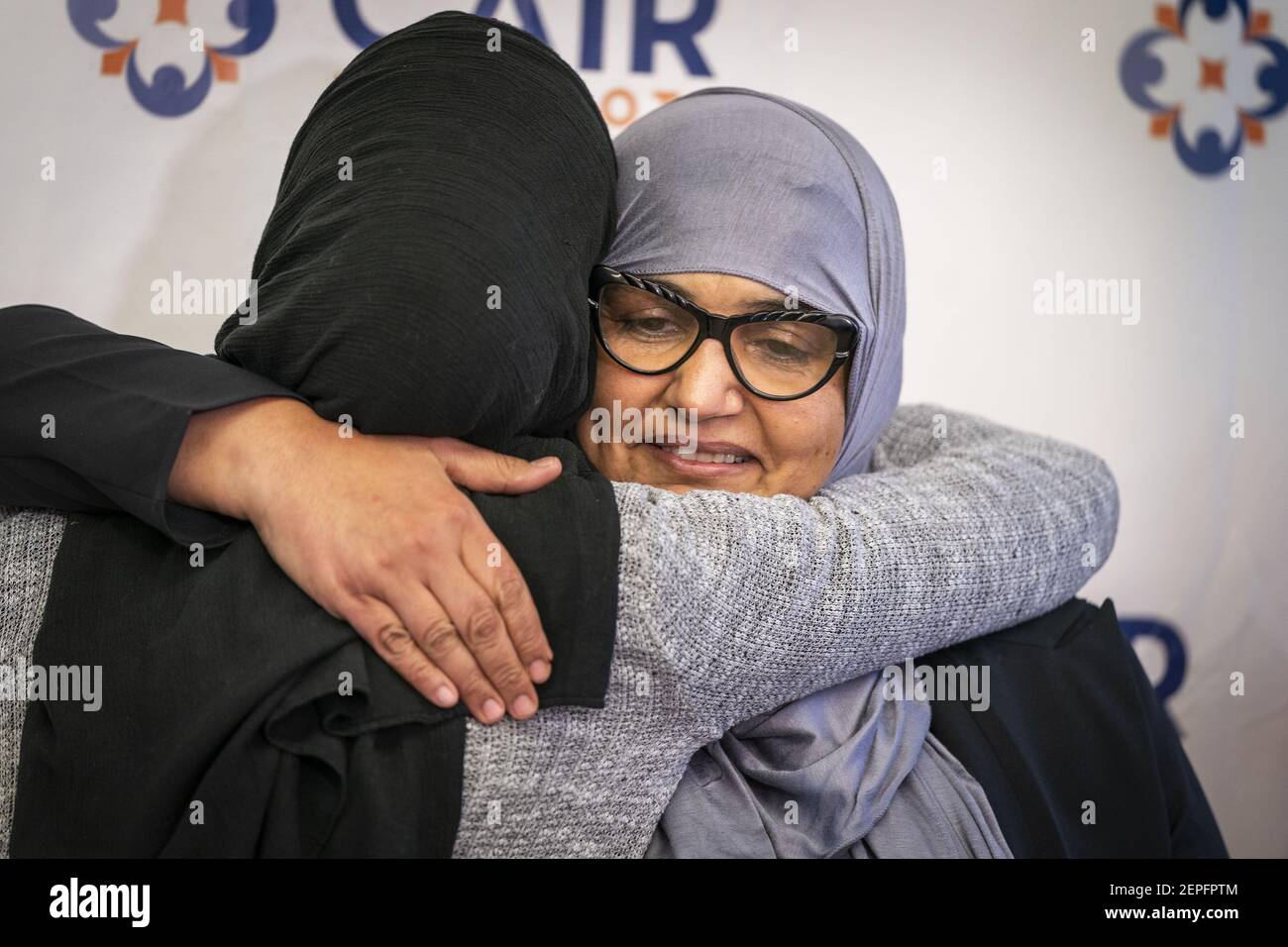 Aida Shyef Al-Kadi, right, of St. Louis Park, receives a hug from Asma Mohammed, advocacy ...