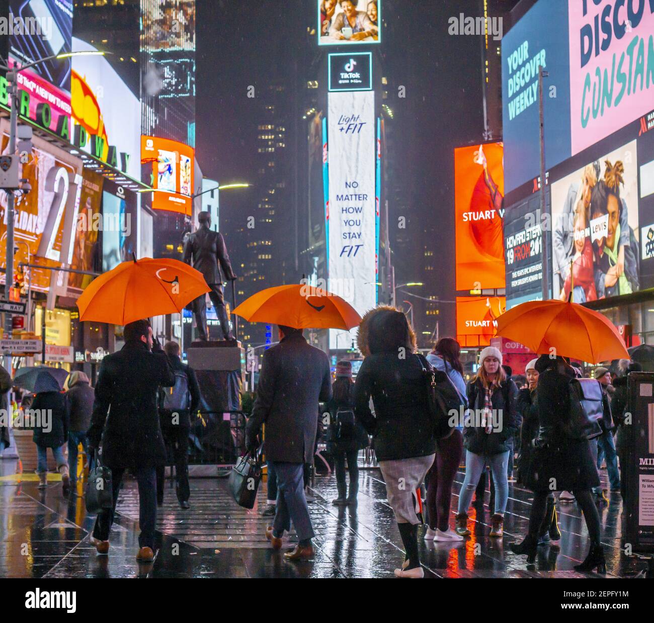 Hordes of tourists descend on a rainy Times Square in New York on Tuesday, December 17, 2019 ...