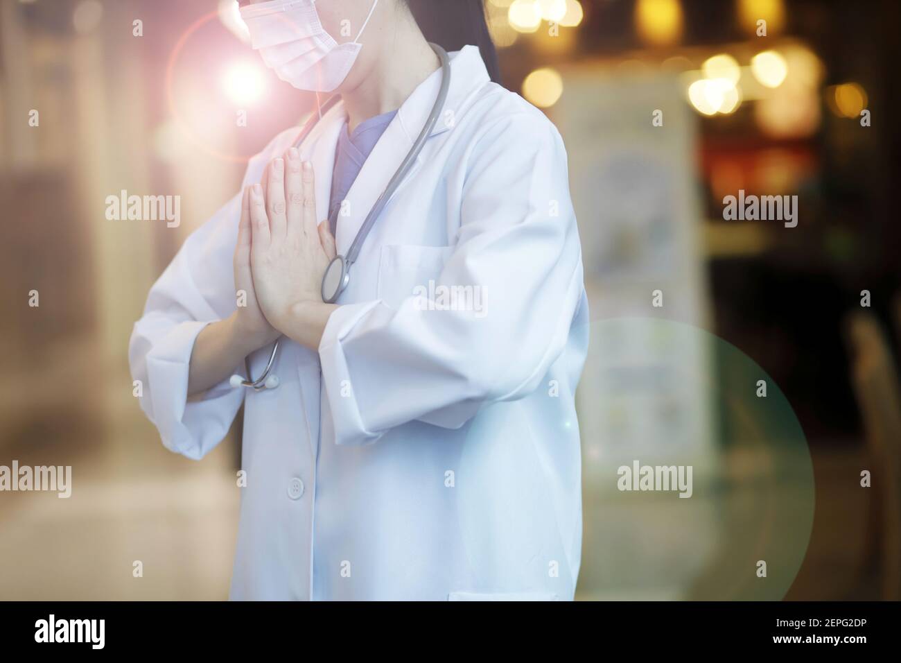 Doctor praying to God with faith and hope Stock Photo - Alamy