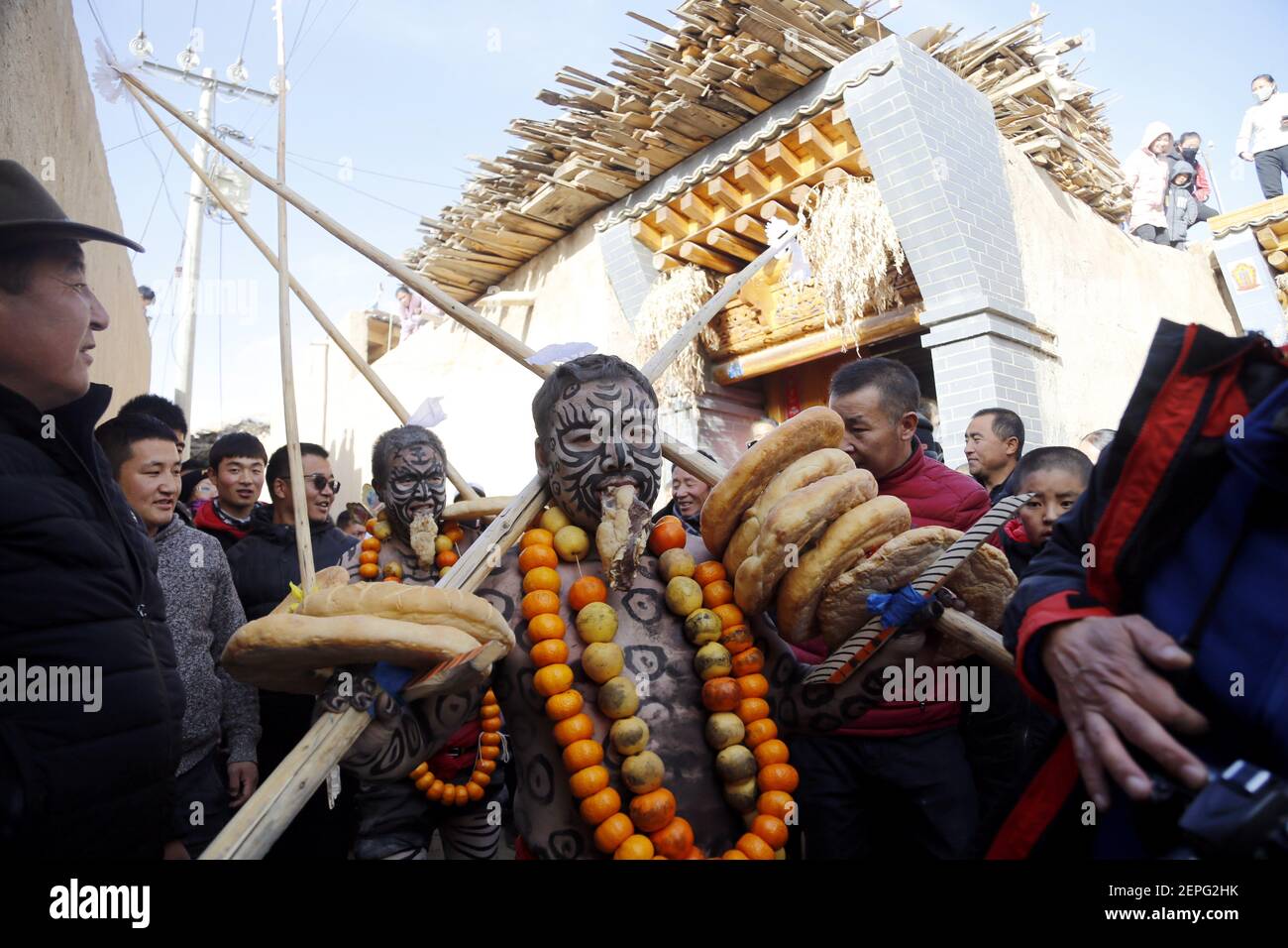 People are playing "Wutu" dance at ritual ceremonies to drive off the ...