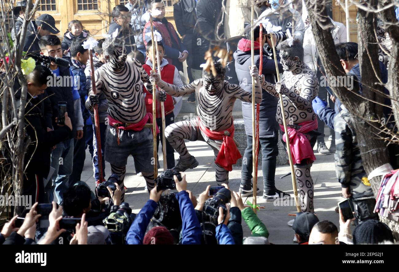 People are playing "Wutu" dance at ritual ceremonies to drive off the ...