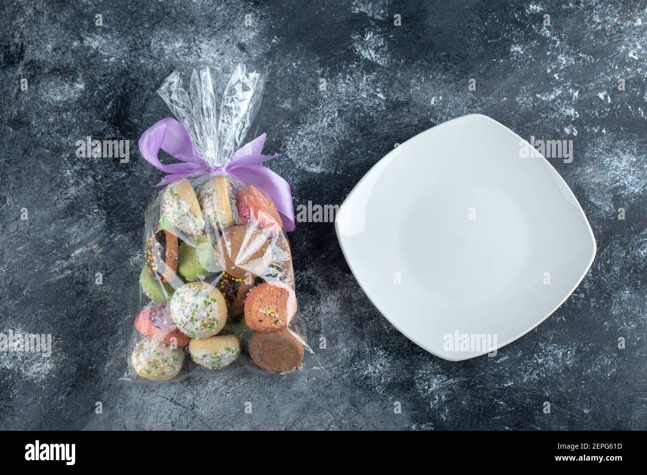 Colorful cookies with sprinkles in plastic bag Stock Photo - Alamy