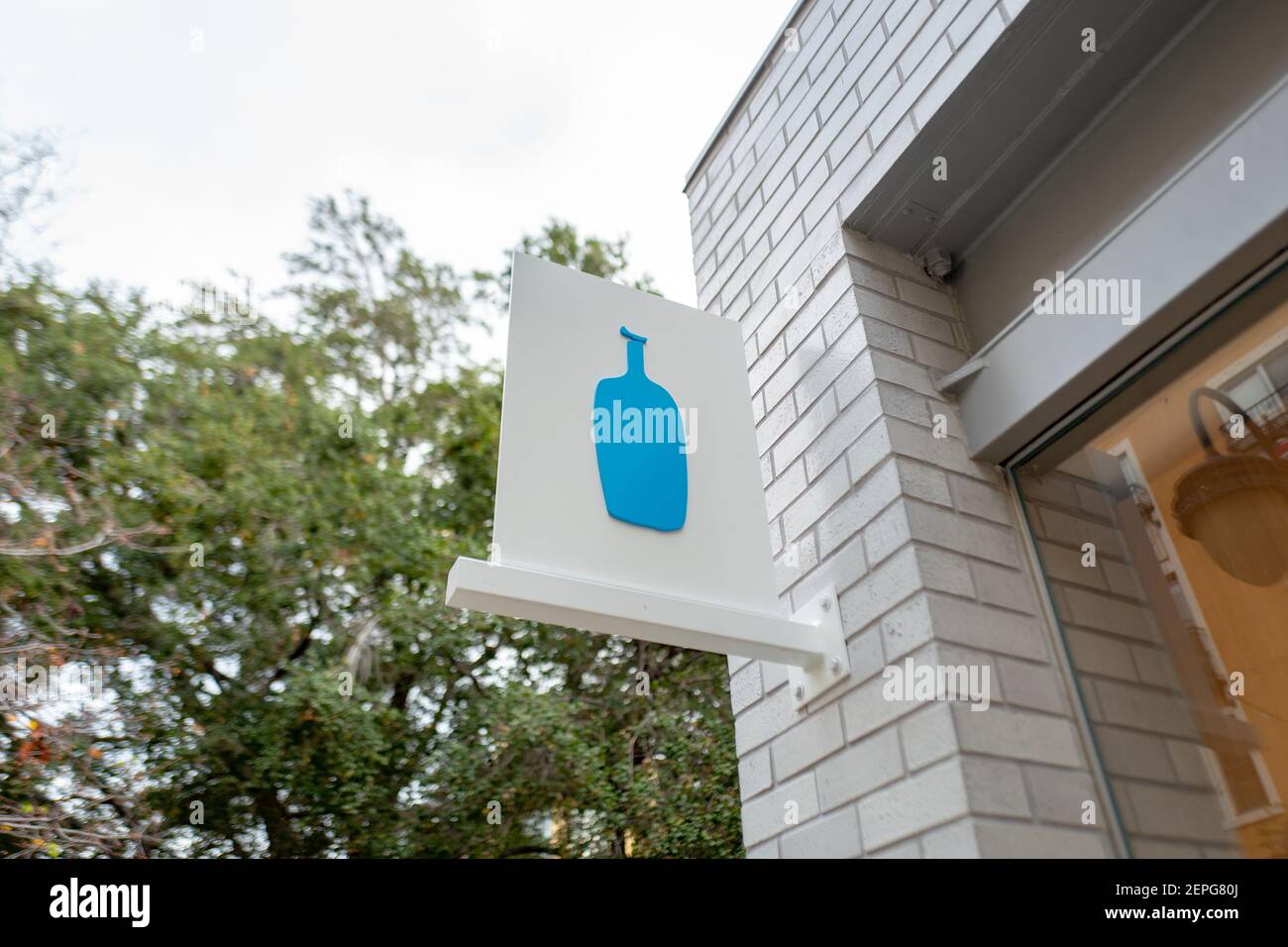 Sign with logo on facade at newly opened Blue Bottle Coffee cafe at the ...
