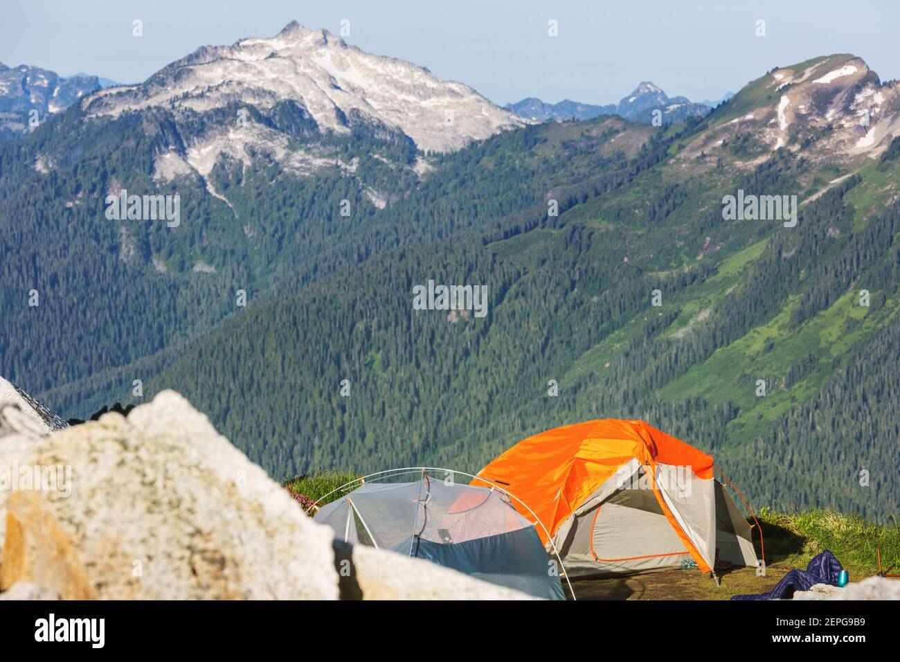 Hiking tent in the mountains in summer season Stock Photo - Alamy