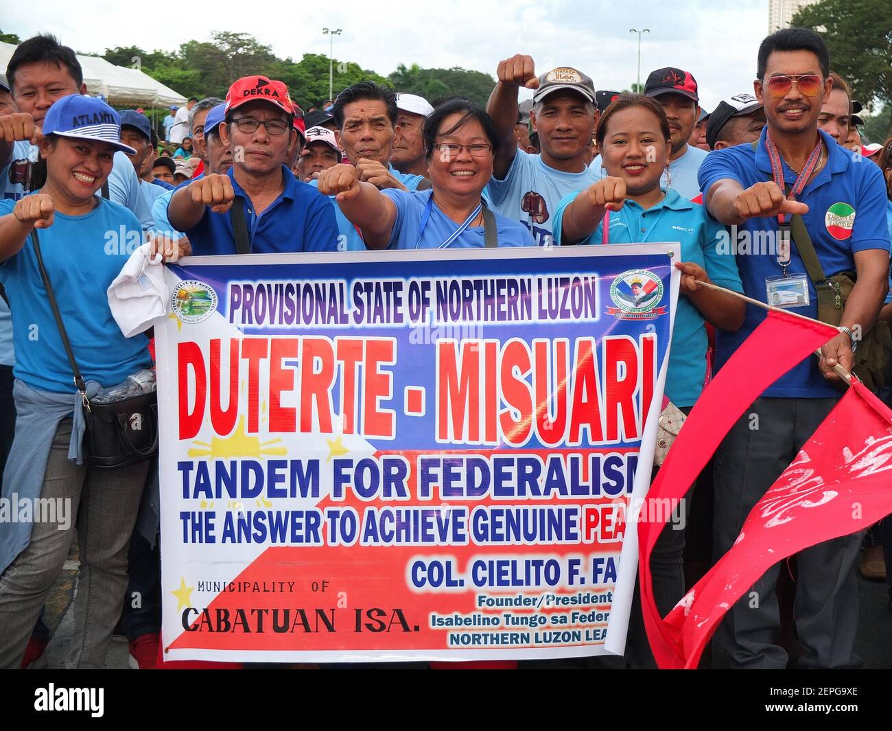 Duterte supporters hold a banner during the protest. Supporters of ...