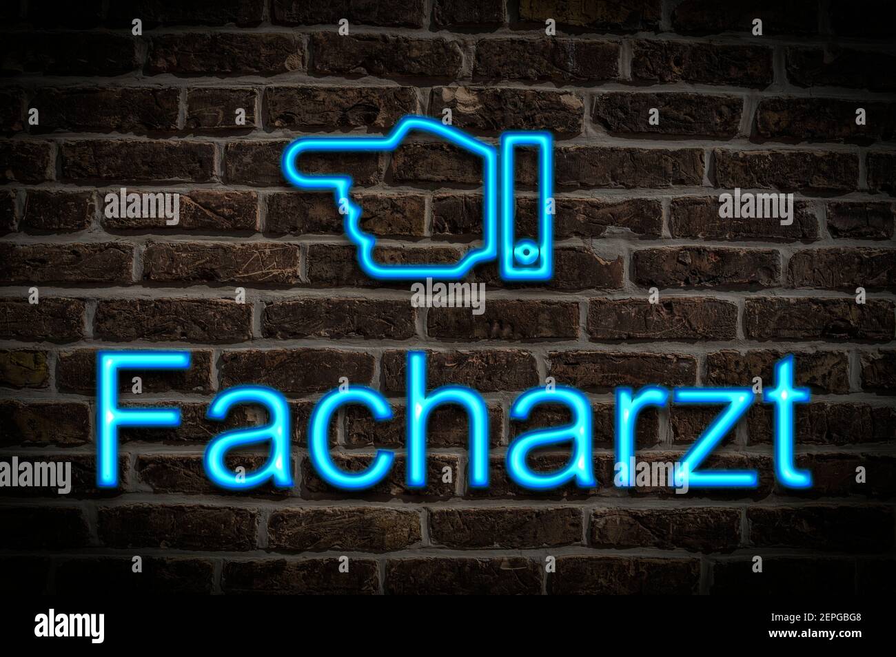 Detail photo of a a neon sign on a wall with the inscription Facharzt ...