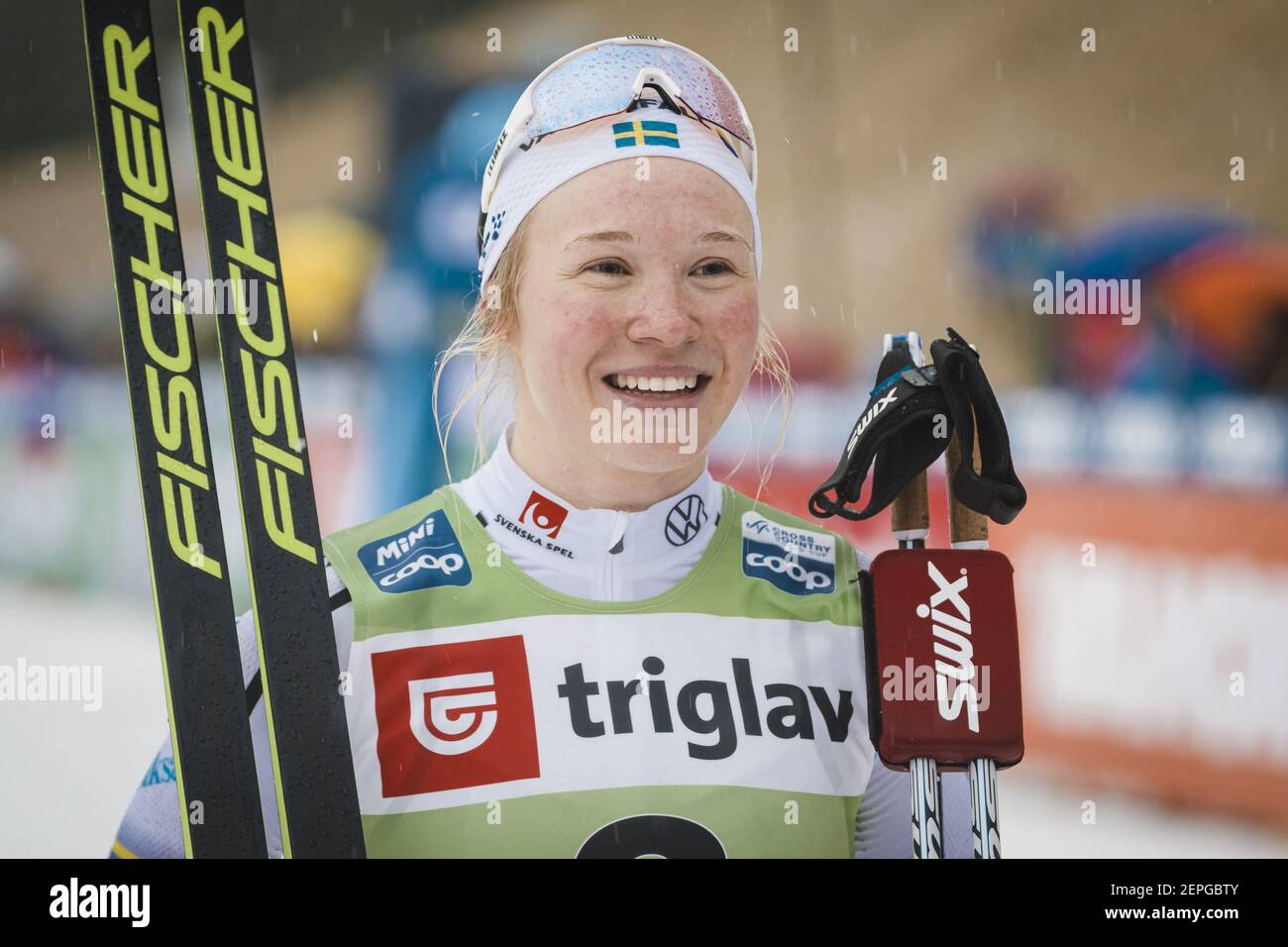 Winner Jonna Sundling of Sweden poses for photos in the finish area ...