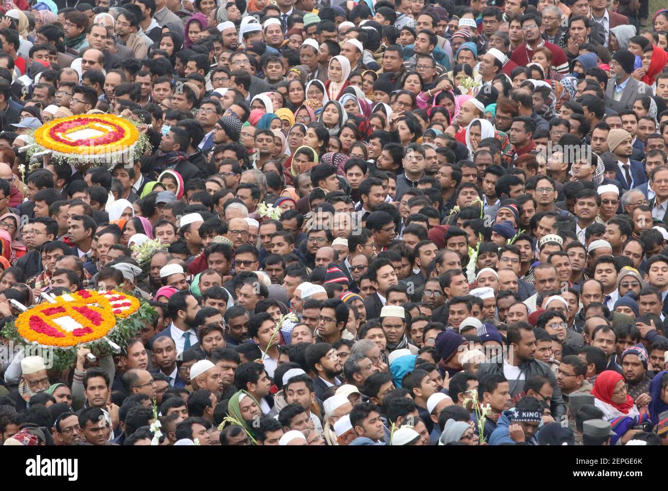 Crowds of people gather during the ceremony at the Banani Graveyard in ...