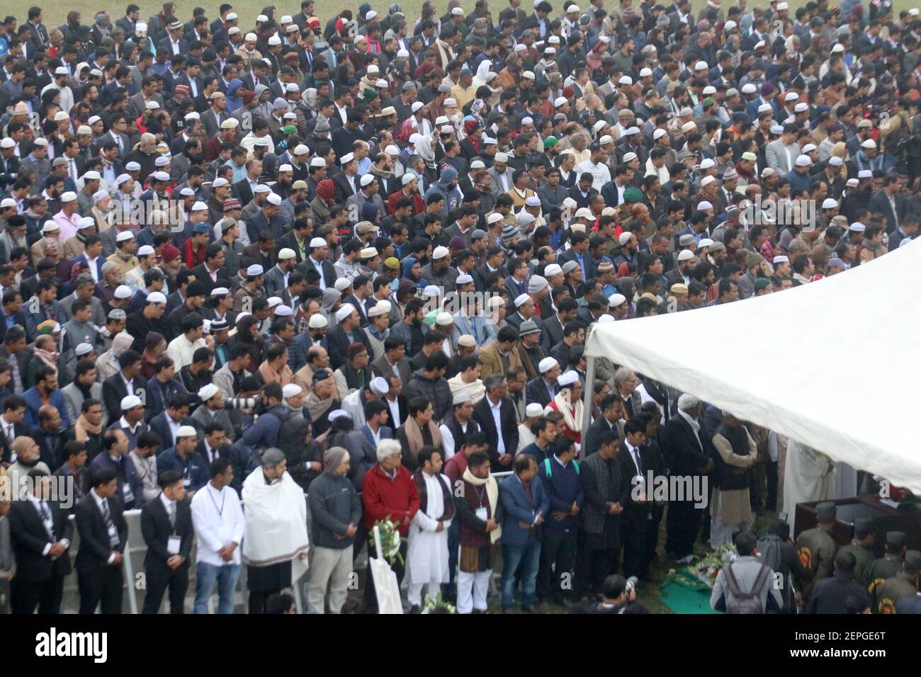 Crowds of people gather during the ceremony at the Banani Graveyard in ...