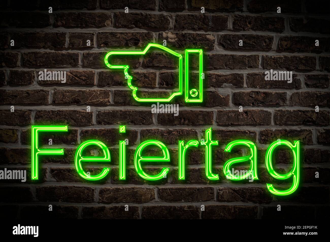 Detail photo of a a neon sign on a wall with the inscription Feiertag ...