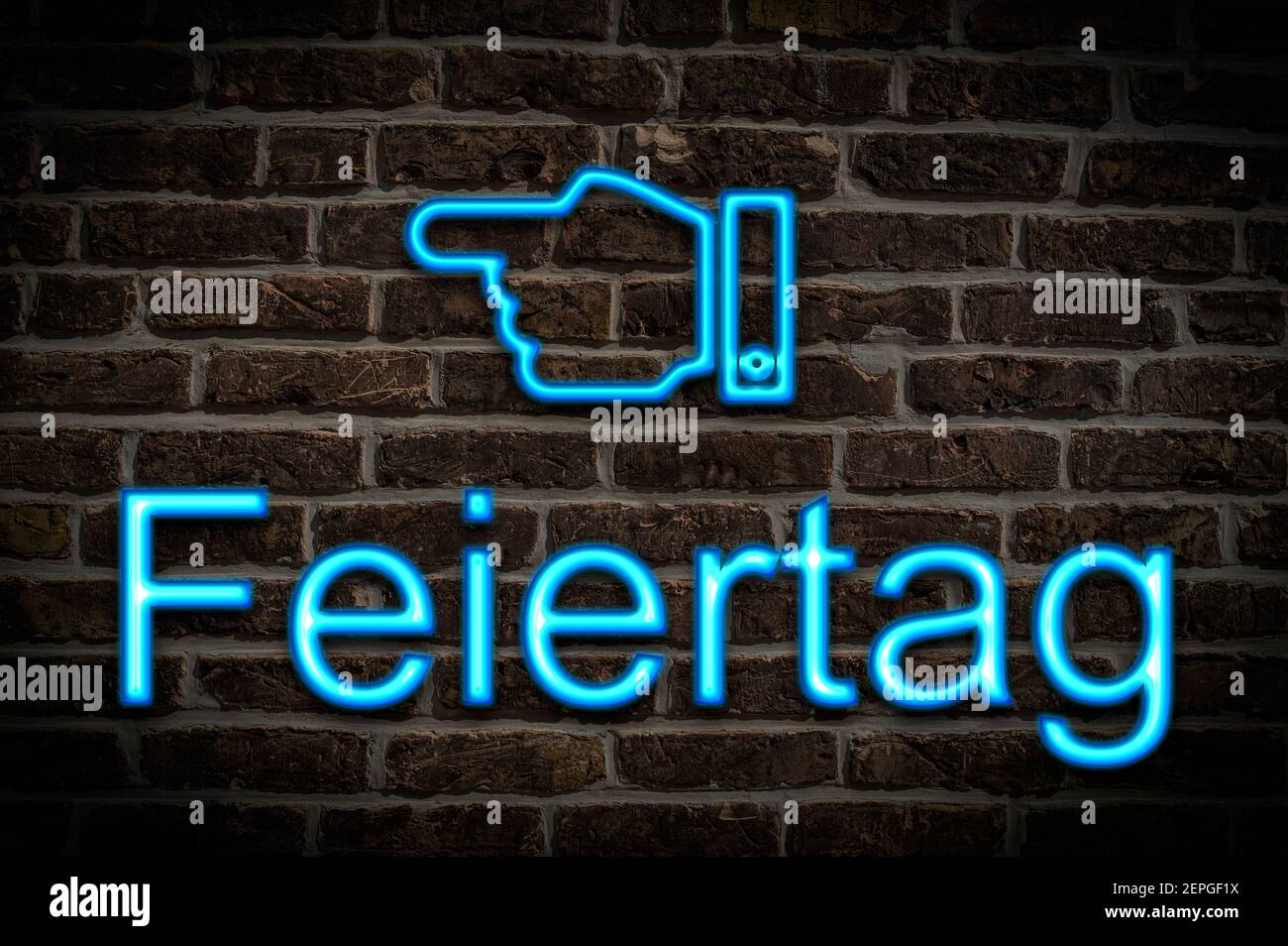 Detail photo of a a neon sign on a wall with the inscription Feiertag ...