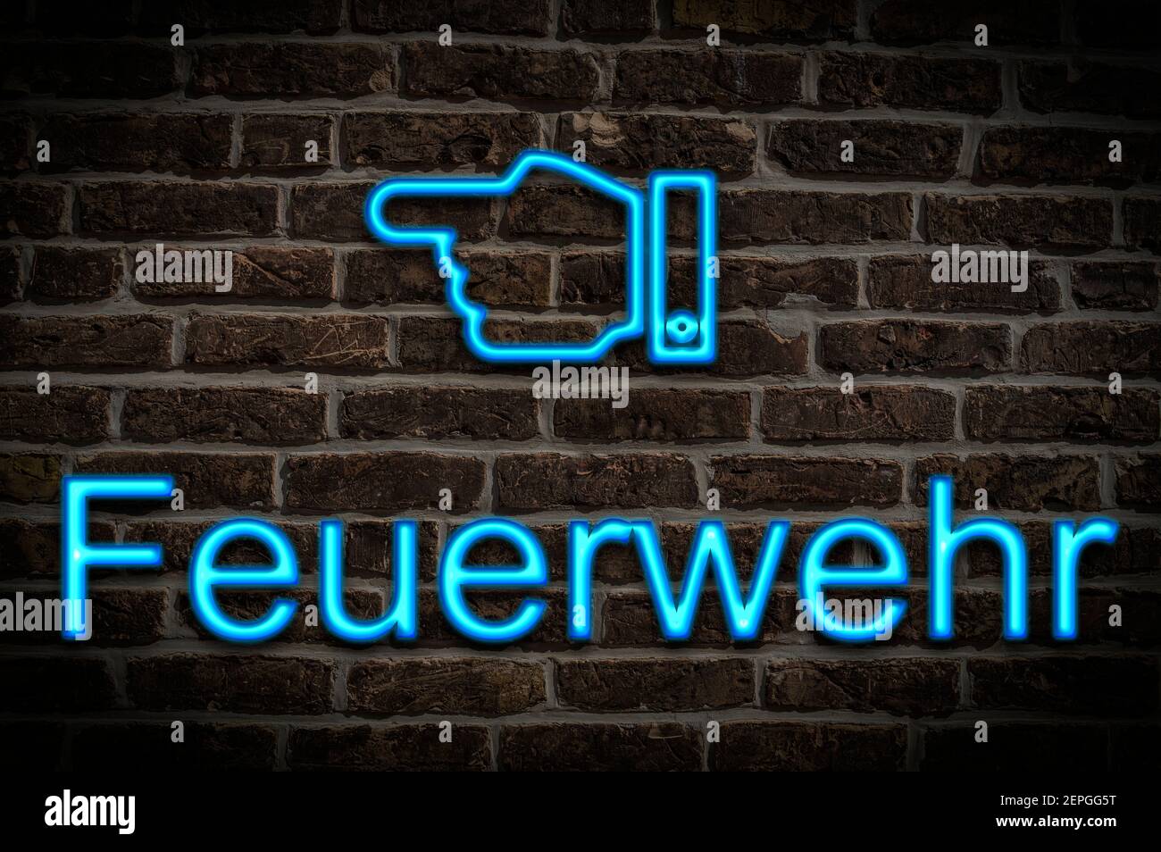 Detail photo of a a neon sign on a wall with the inscription Feuerwehr ...