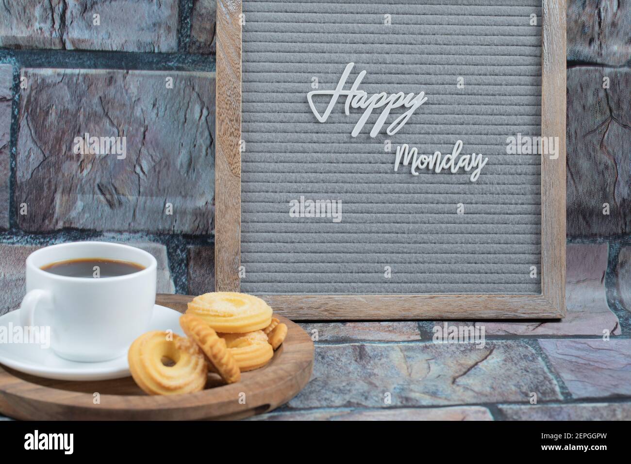Happy monday poster with a cup of drink and cookies around Stock Photo ...