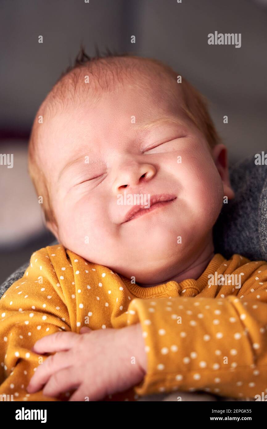 A contented, sleeping newborn baby girl Stock Photo - Alamy