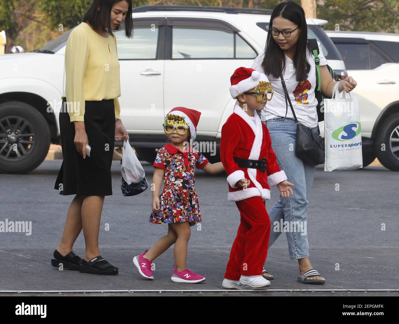 kids dressed in Santa Claus costumes during the Christmas celebration ...