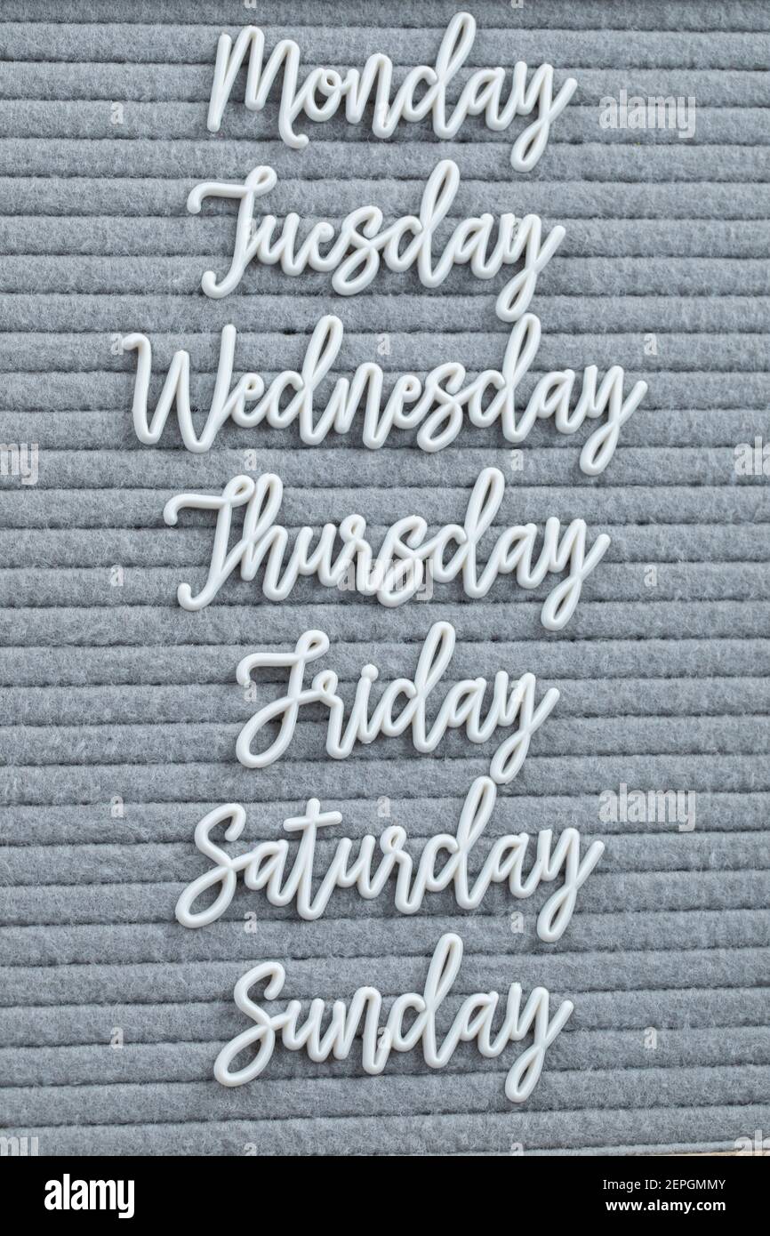 Happy weekdays posters embedded on grey background Stock Photo - Alamy