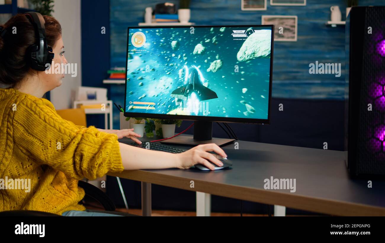 Professional esport woman gamer compete in a video game playing on a ...