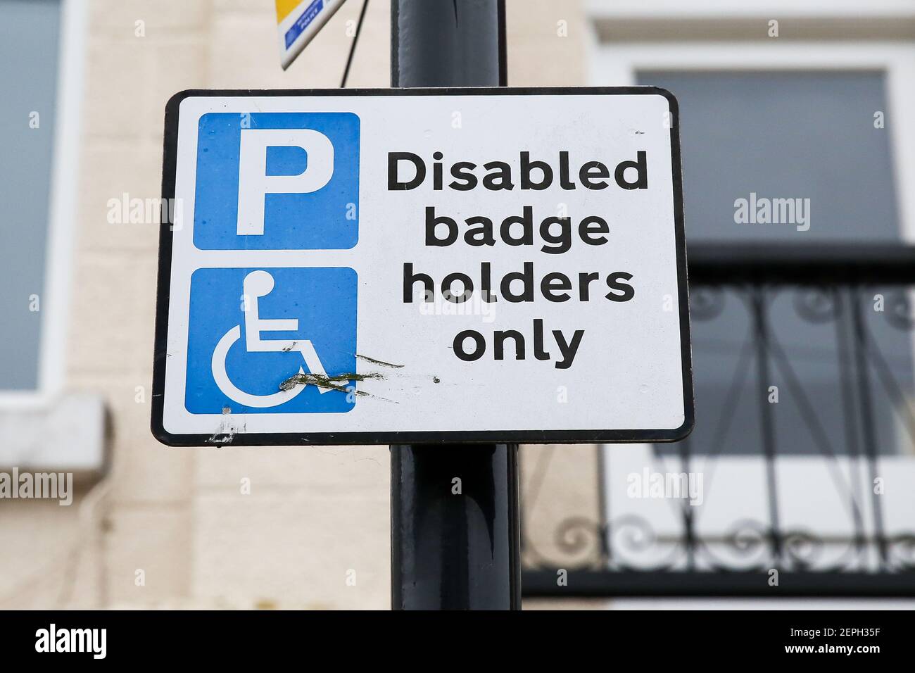 A disabled badge holder only sign is seen in north London. Thousands of ...