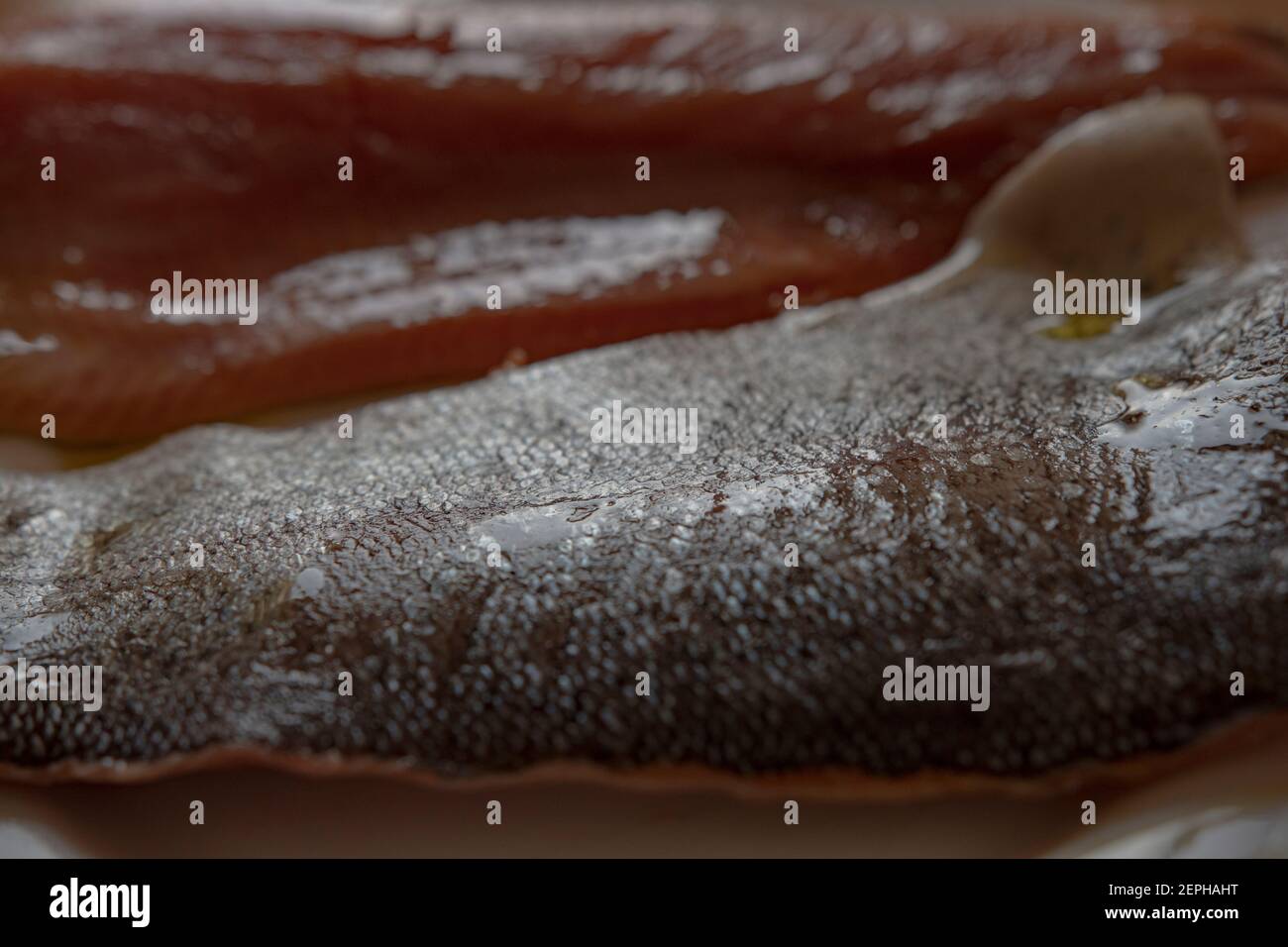Woman cooking trout Stock Photo - Alamy