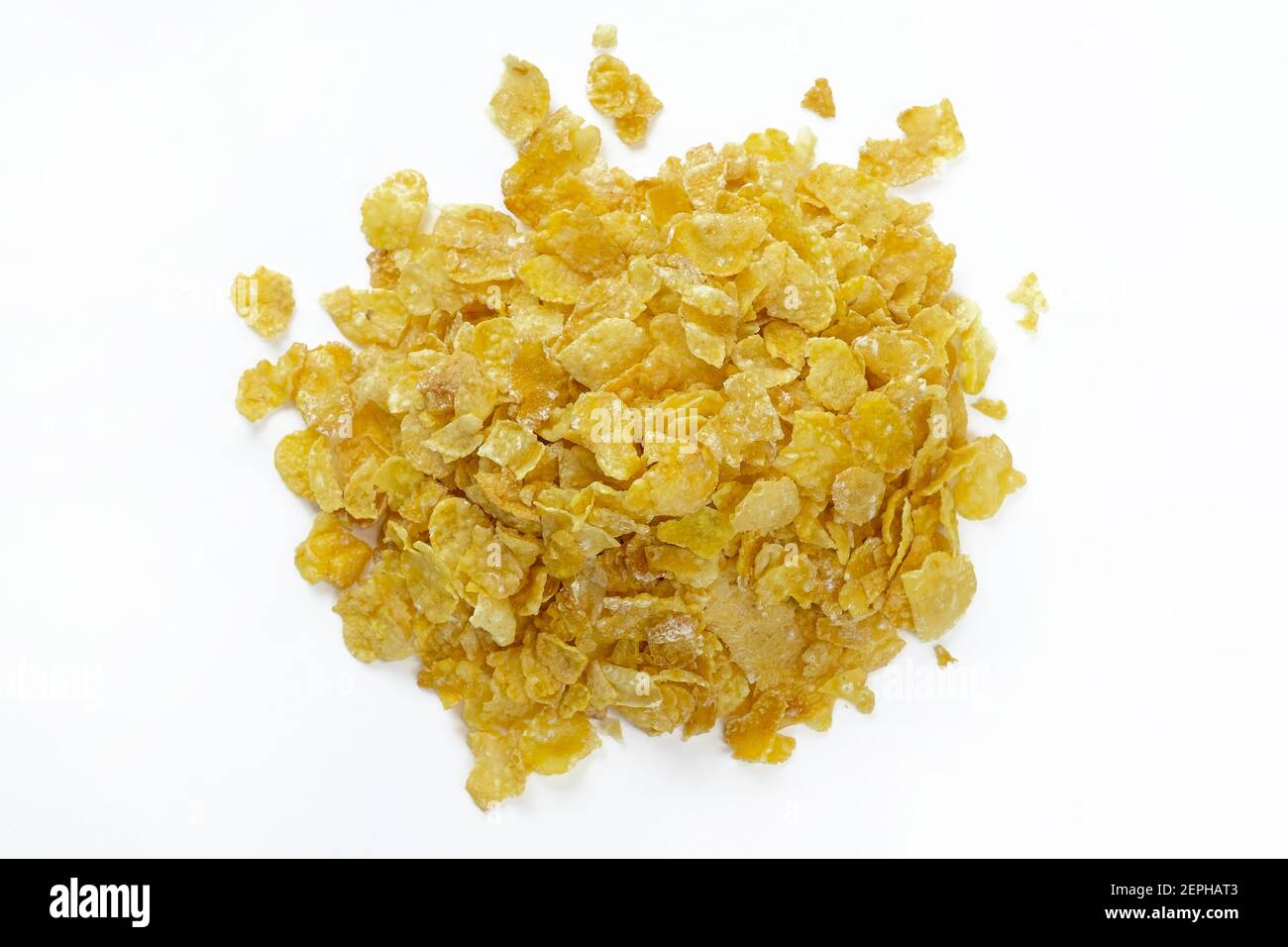 Dry corn flakes on a white background top view. Thin cornflakes in ...