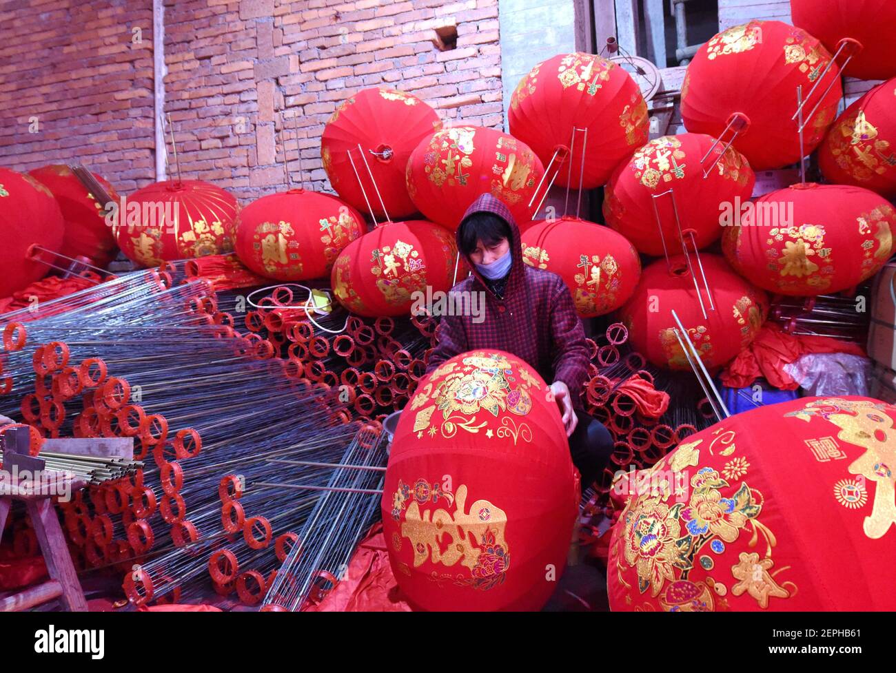 The workers are making the red lanterns for the coming new year in ...