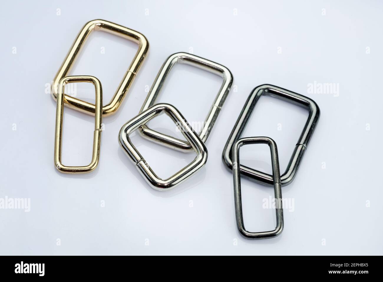 Metal frames for a bag strap. Belt adjuster in gold and silver ...