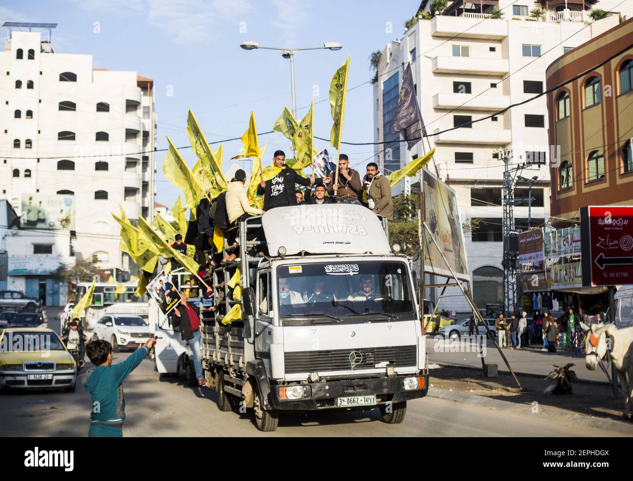 Palestinian supporters of the Fatah movement take part during a rally ...
