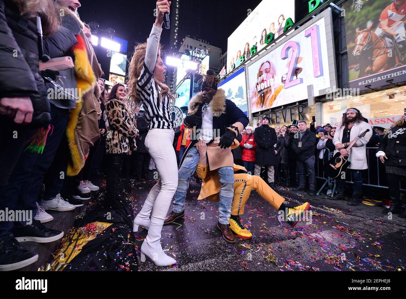 NEW YORK CITY - DECEMBER 31: (L-R) Co-host Maria Menounos and WWE stars ...