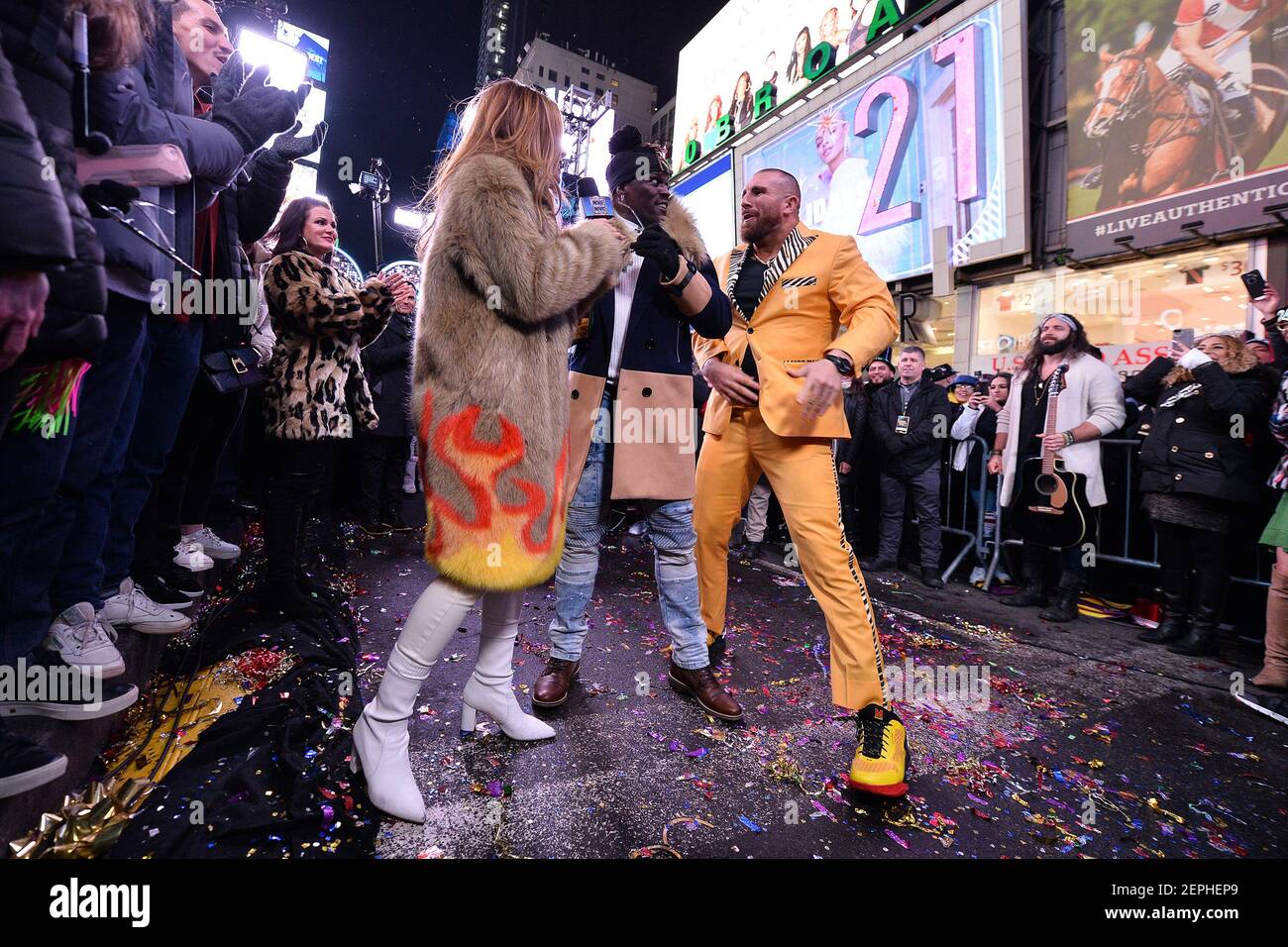NEW YORK CITY - DECEMBER 31: (L-R) Co-host Maria Menounos and WWE stars ...