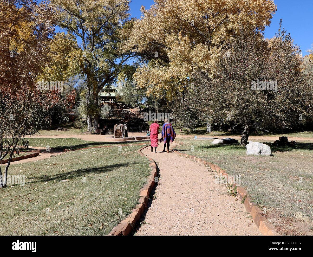 Resort guests stroll through the walking paths in the design of a ...