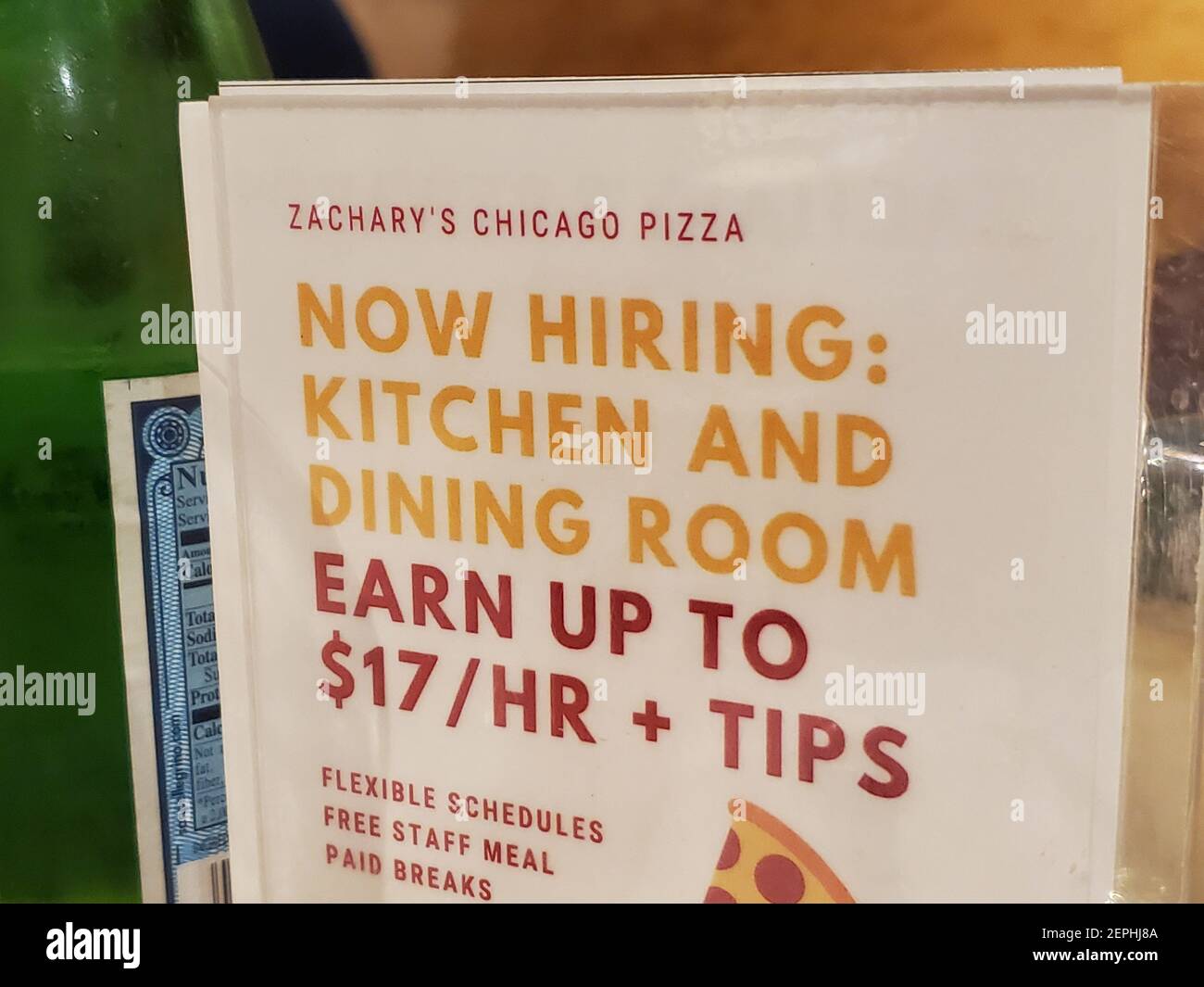 Close-up of printed help wanted sign in local pizza restaurant Zacharys ...