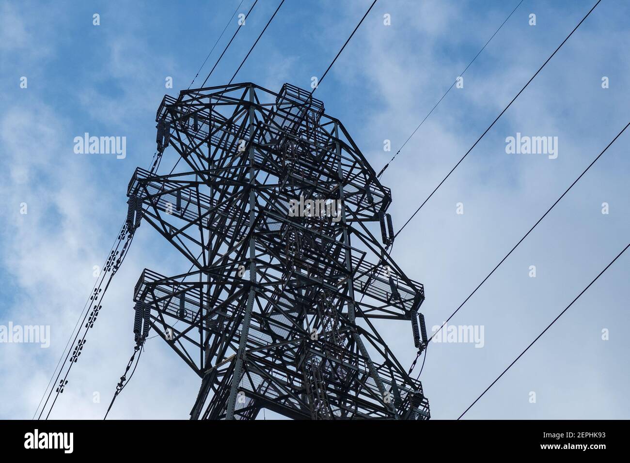 Overhead electrical tower with connected power lines Stock Photo - Alamy