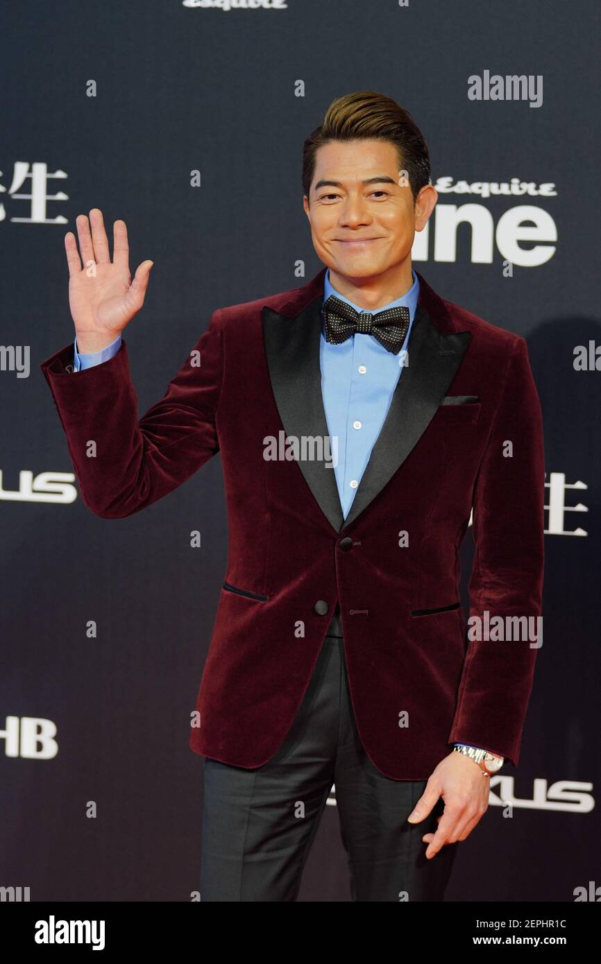 --FILE--Hong Kong singer, dancer and actor Aaron Kwok Fu-shing poses in red suit to take ...