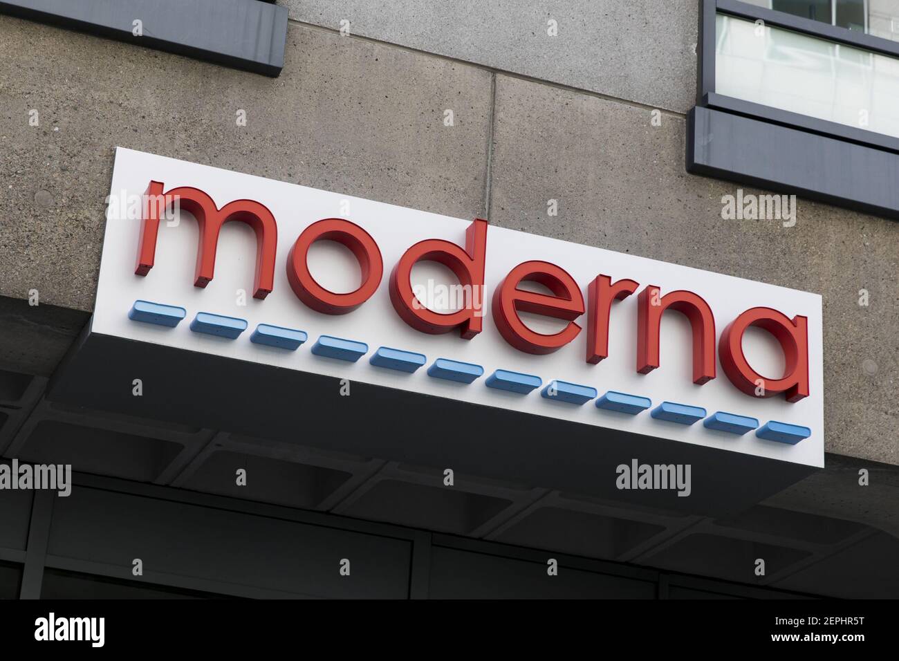 A logo sign outside of the headquarters of Moderna Therapeutics in ...