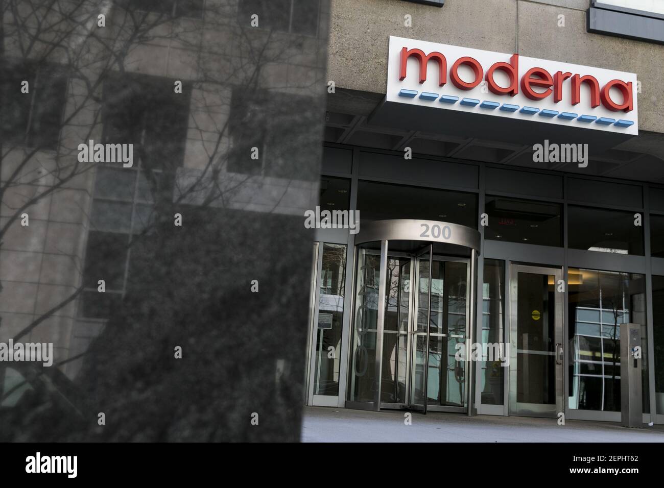 A logo sign outside of the headquarters of Moderna Therapeutics in ...