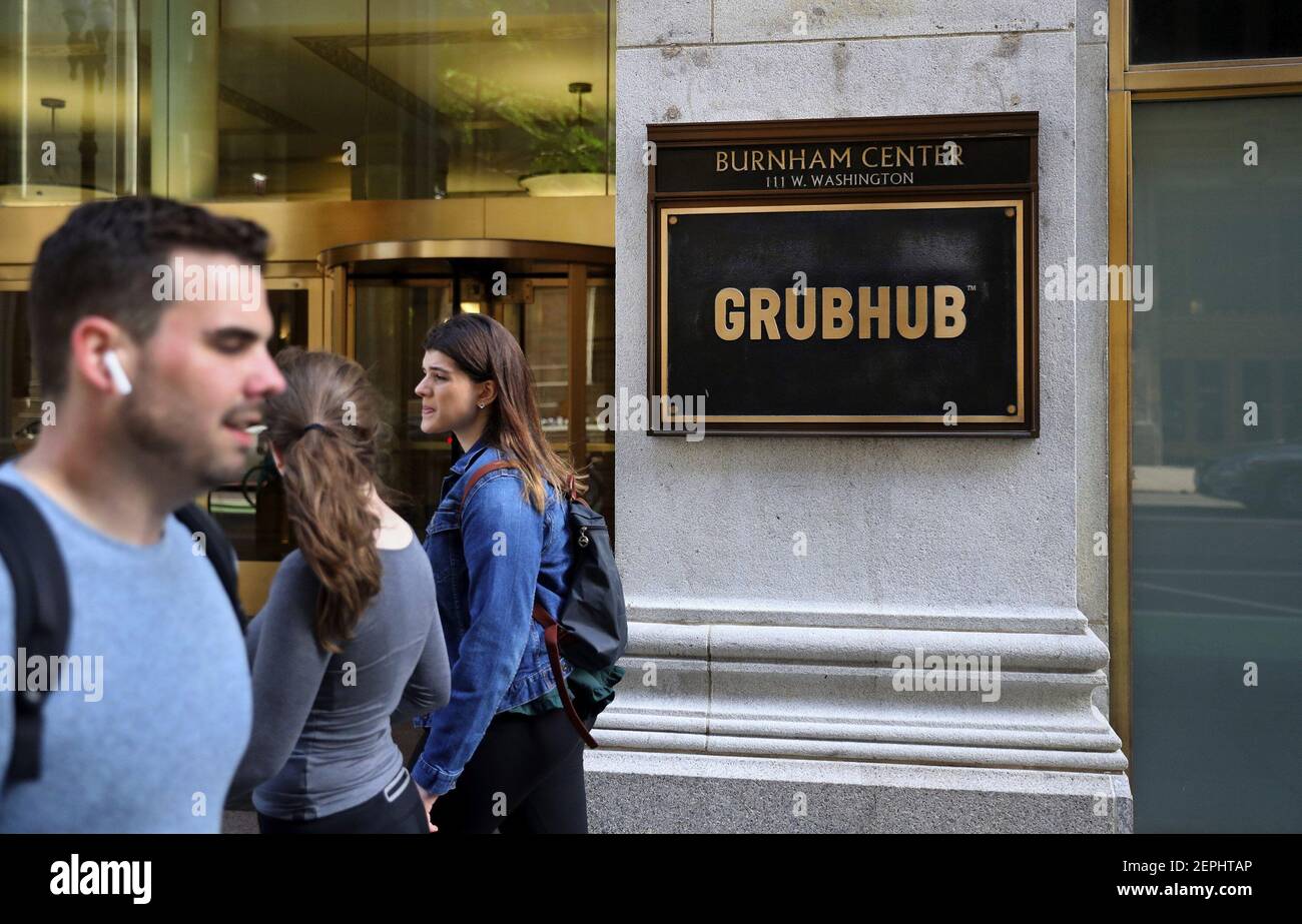Downtown workers pass by the Burnham Center, home to Grubhub's Chicago ...